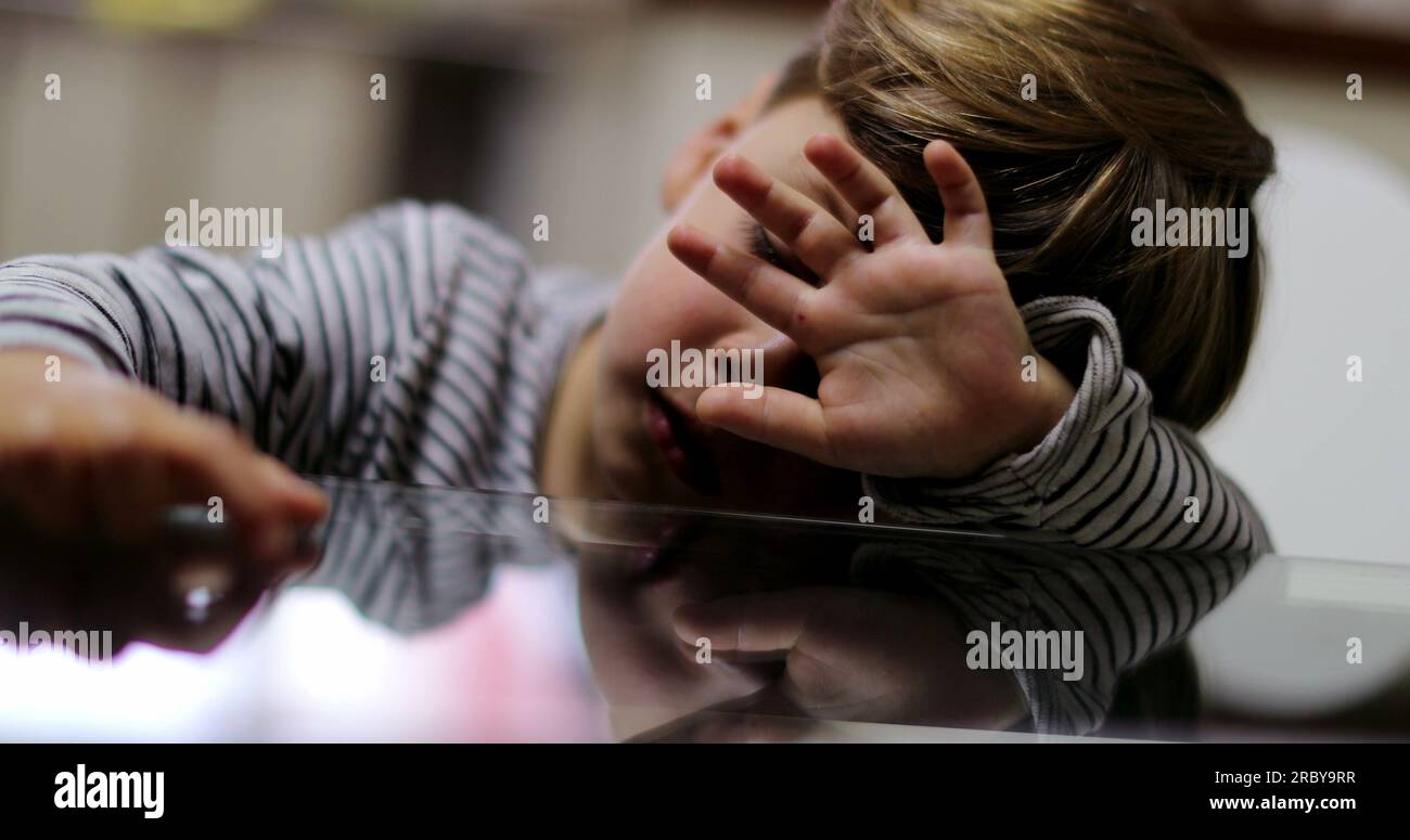 Sad small boy covering face with hand feeling sad and depressed Stock ...