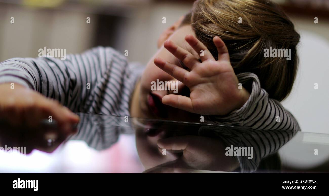 Sad small boy covering face with hand feeling sad and depressed Stock ...