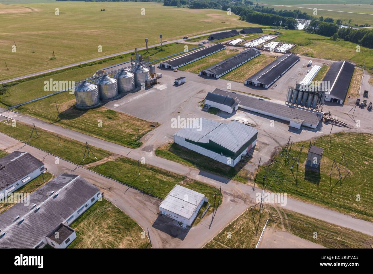 aerial panoramic view on agro-industrial complex with silos and grain ...