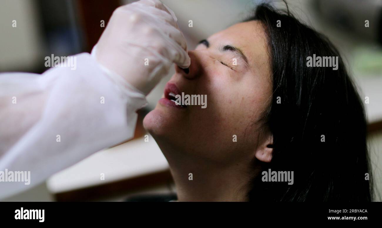 Person doing nose covid hi-res stock photography and images - Alamy