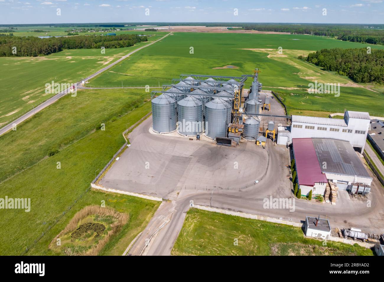 aerial panoramic view on agro-industrial complex with silos and grain ...