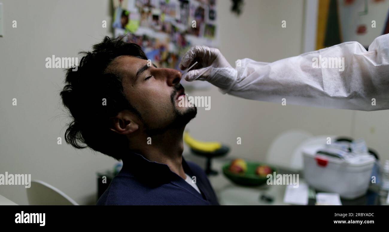 Person doing nose covid test PCR procedure at home Stock Photo - Alamy