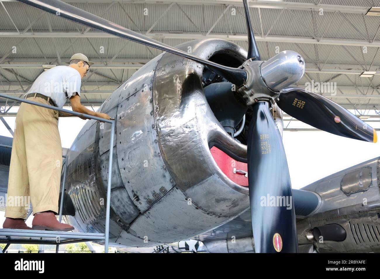 Mock worker next to an engine of the USAF Boeing B-29 Superfortress T ...