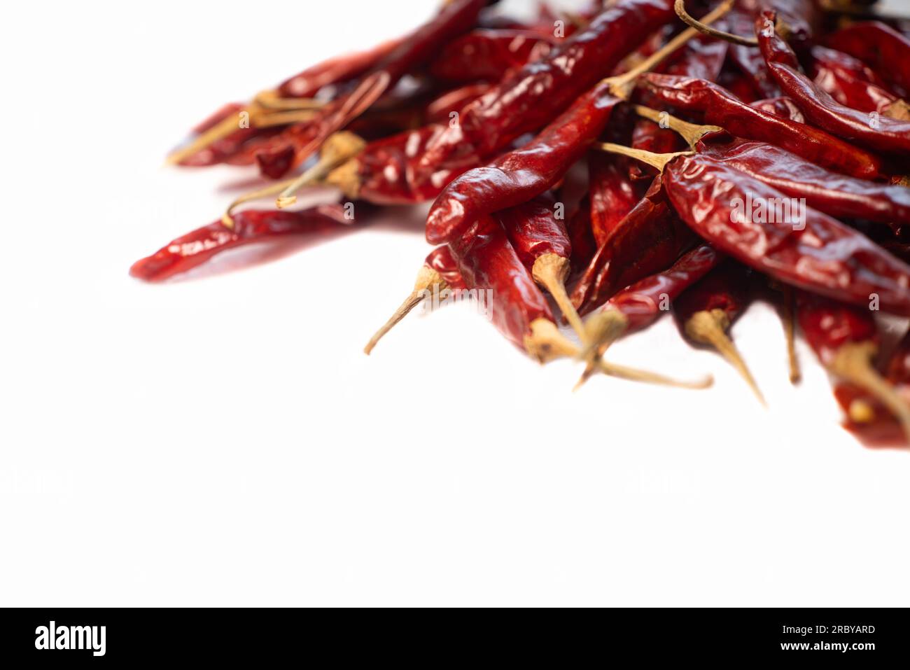 Bright Red dried red chillies are display on white background Stock ...