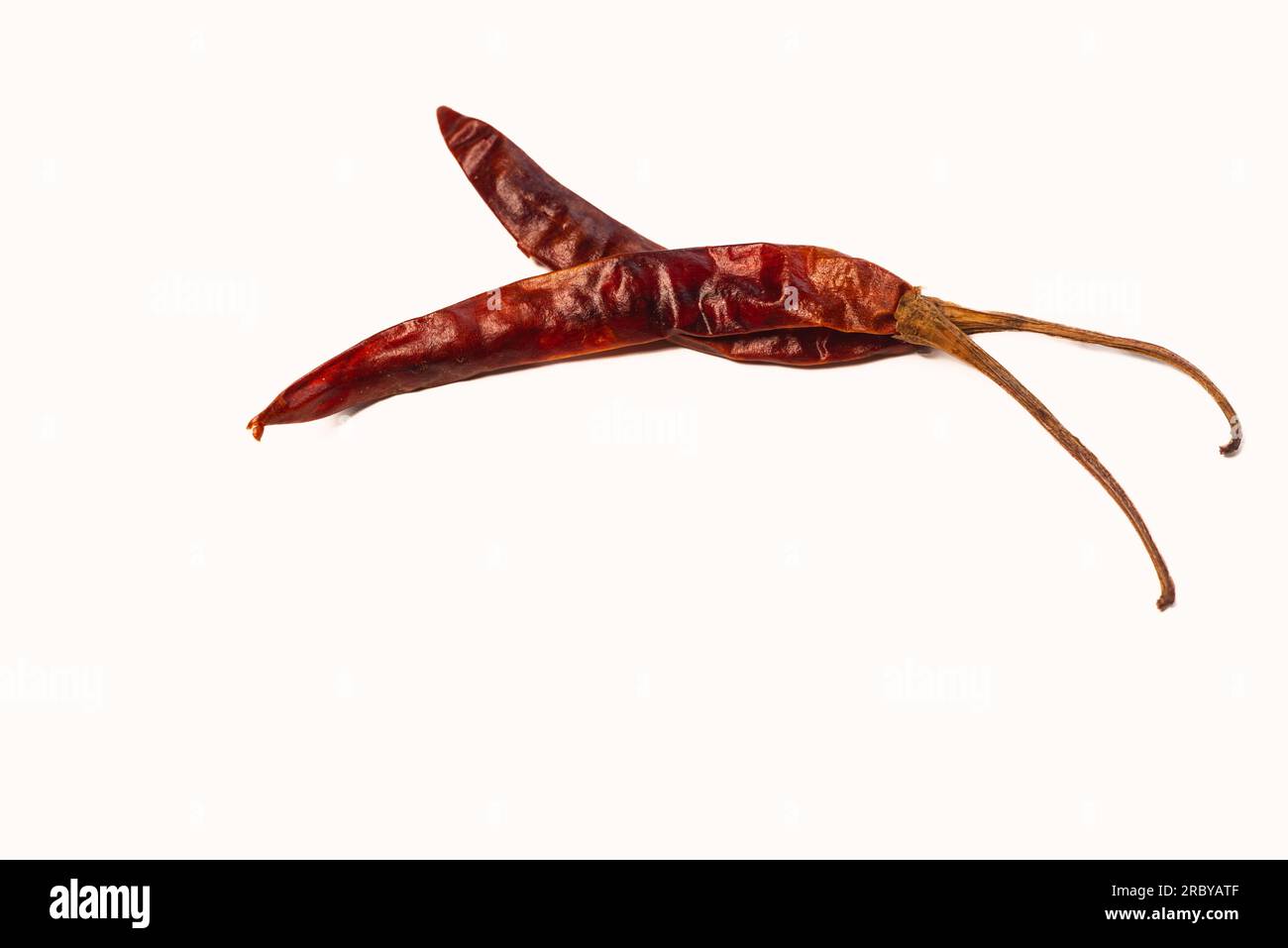 Bright Red dried red chillies are display on white background Stock ...