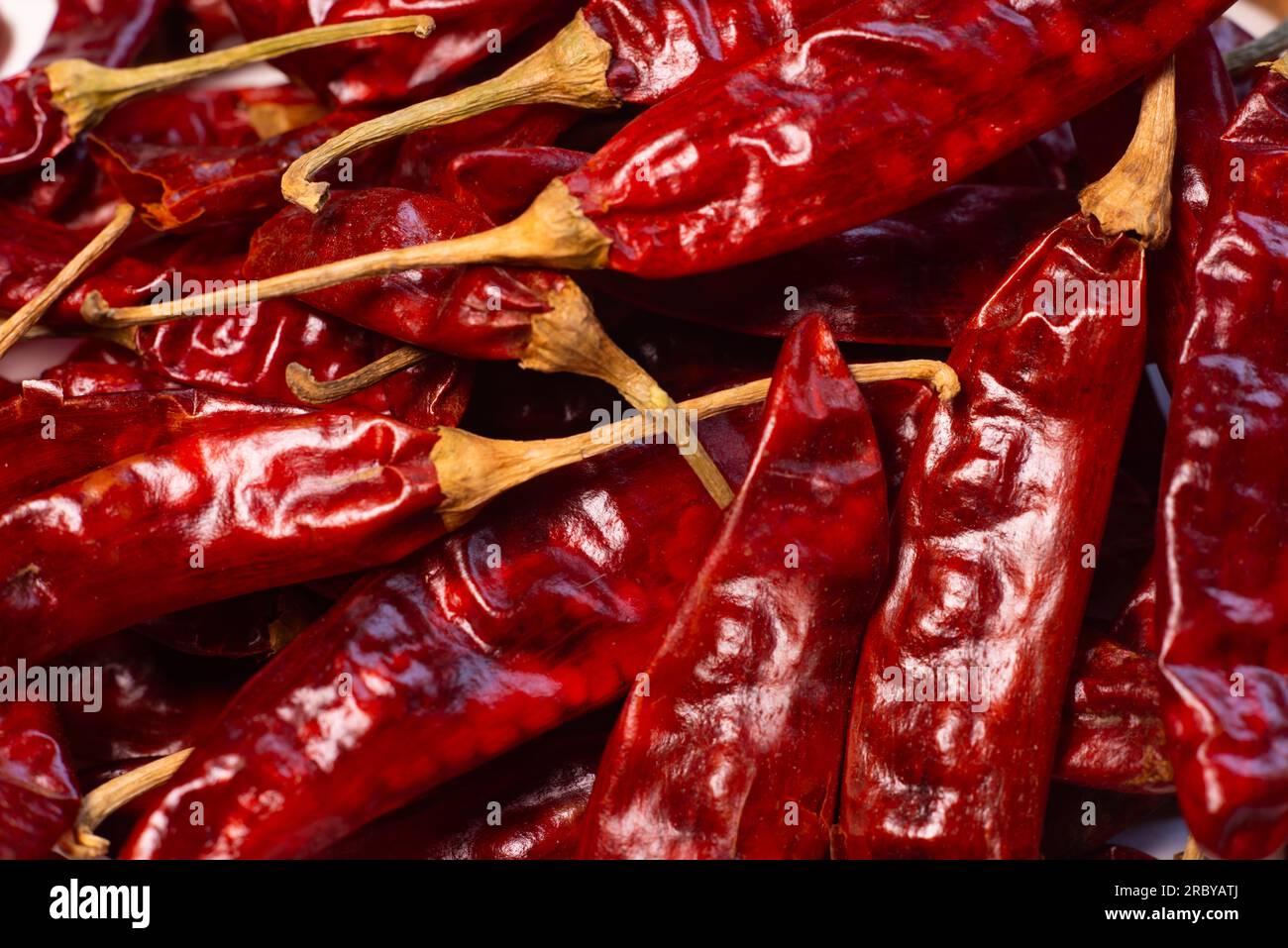 Bright Red dried red chillies are display on white background Stock ...