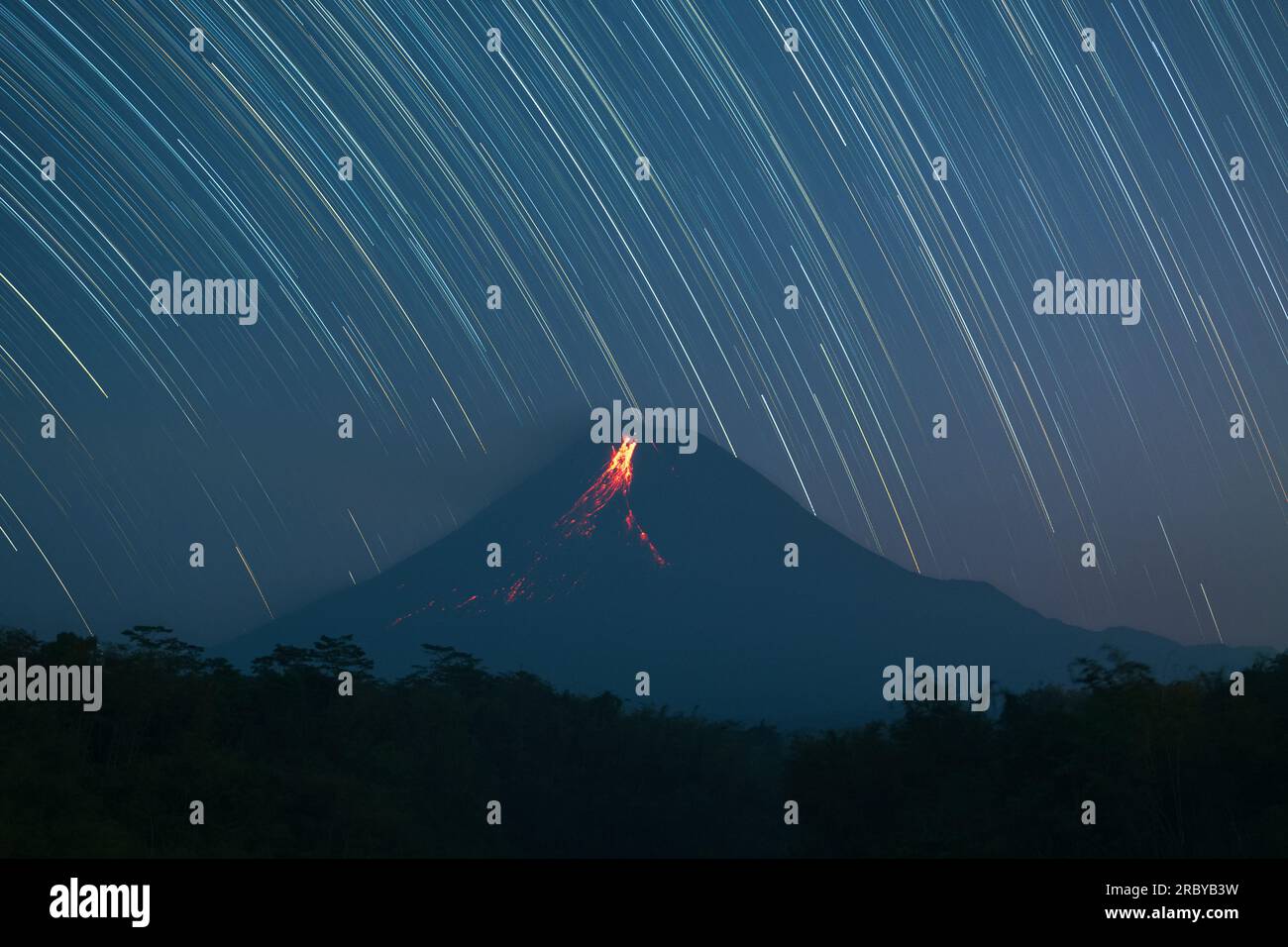 Mount Merapi volcano eruption glowing lava flow at night with star ...