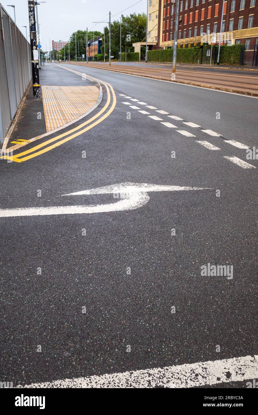 road markings at a give way junction on the road and white painted ...