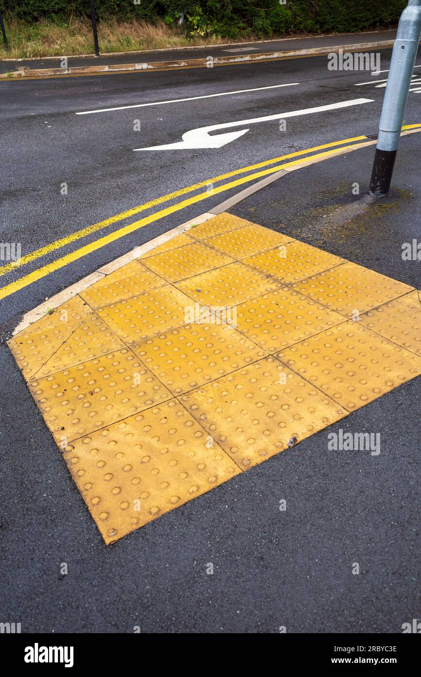 Tactile paving bumps to warn people with sight loss of a danger or ...