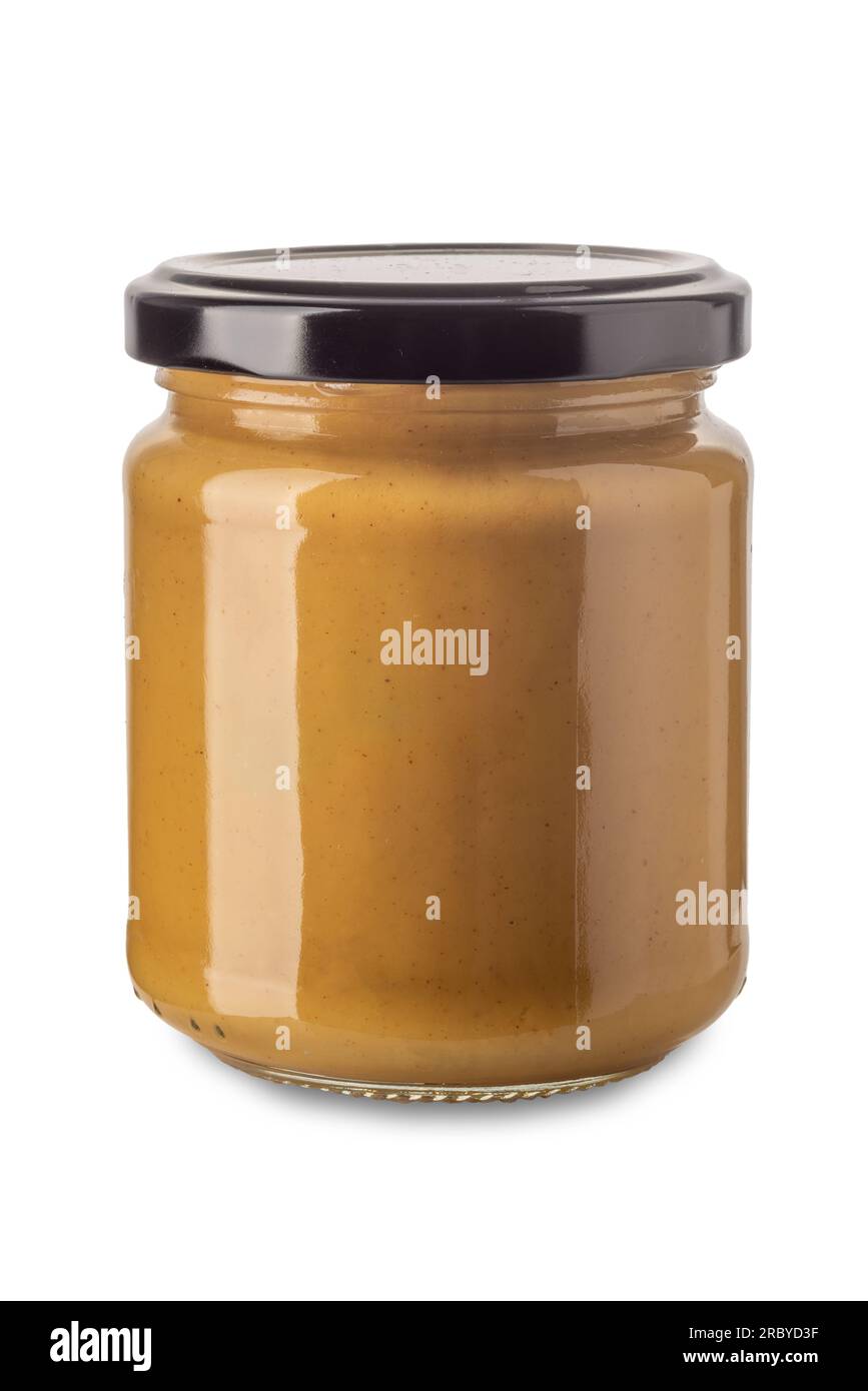 Mustard sauce in glass jar isolated on white with clipping path ...