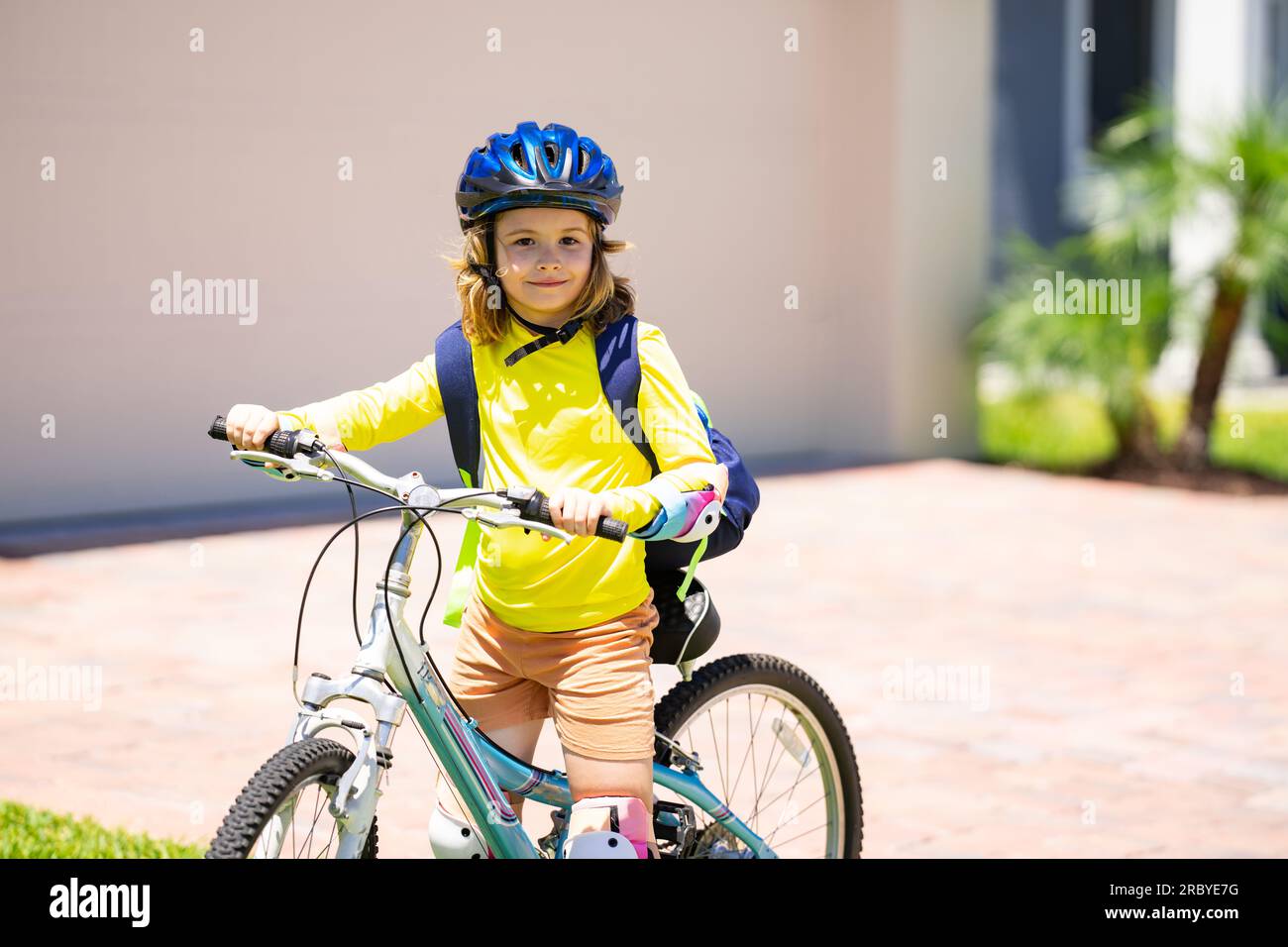 Little kid boy ride a bike in the park. Kid cycling on bicycle. Happy ...