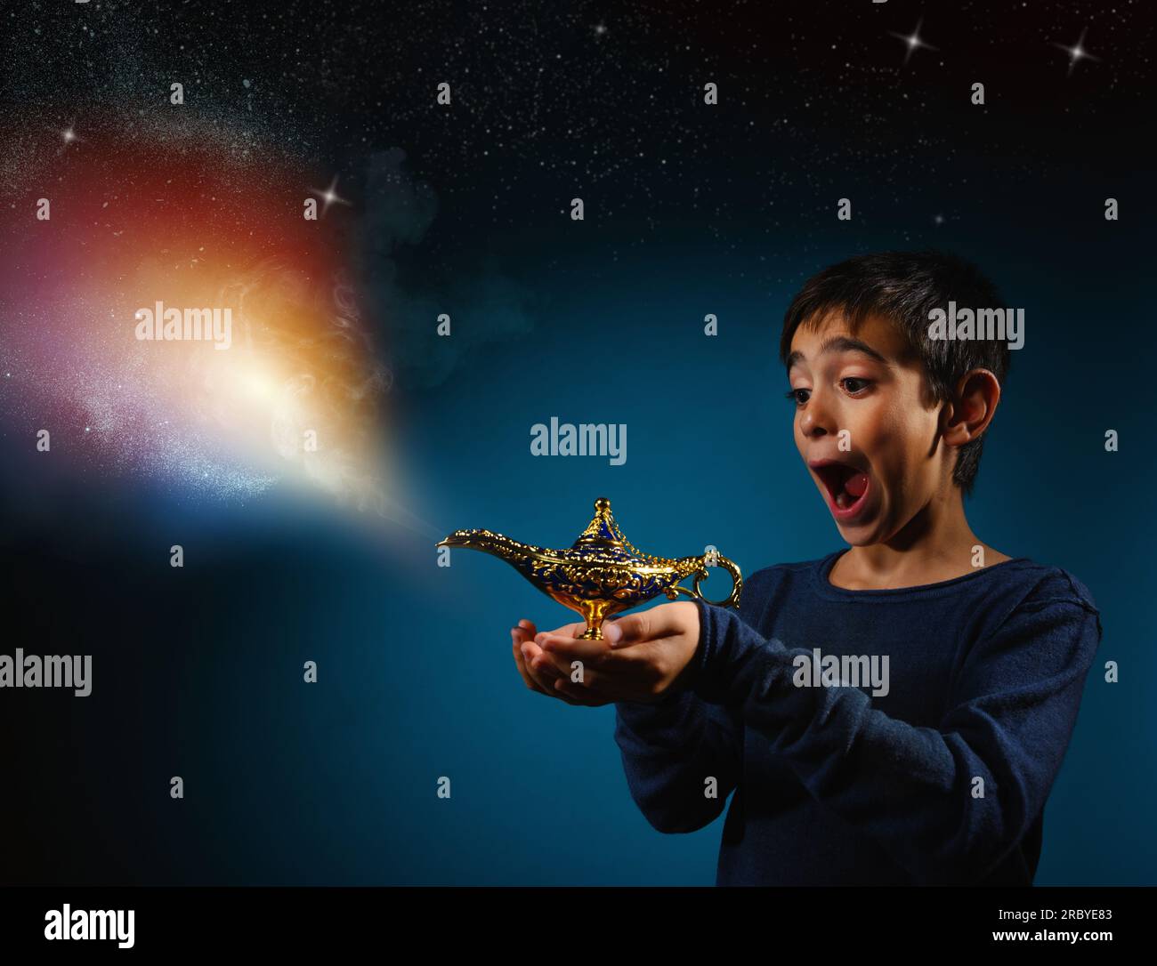 Amazed child with magic Aladin lamp in hand Stock Photo - Alamy