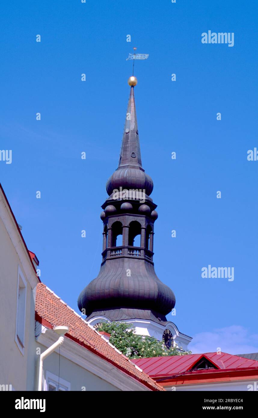 Classical tower spire with golden weather vane in Tallinn, Estonia ...