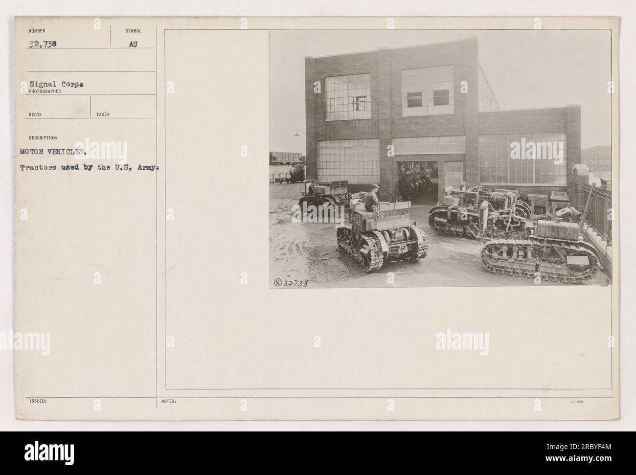 A group of U.S. Army personnel working with motor vehicles during World ...