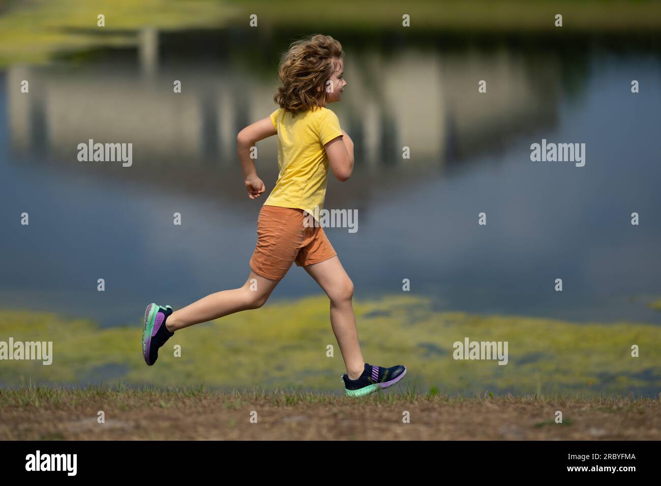 Excited Kid running in street. Amazed child enjoy run. Happy little boy ...