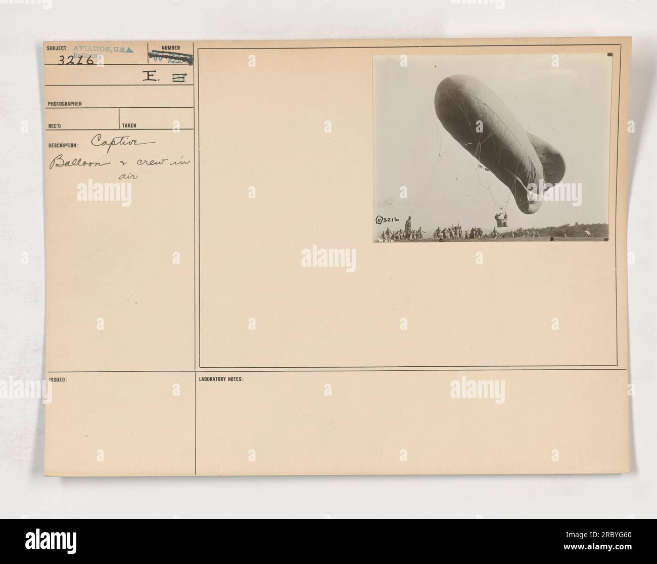 Captive balloon with crew in air. This photograph showcases a captive ...