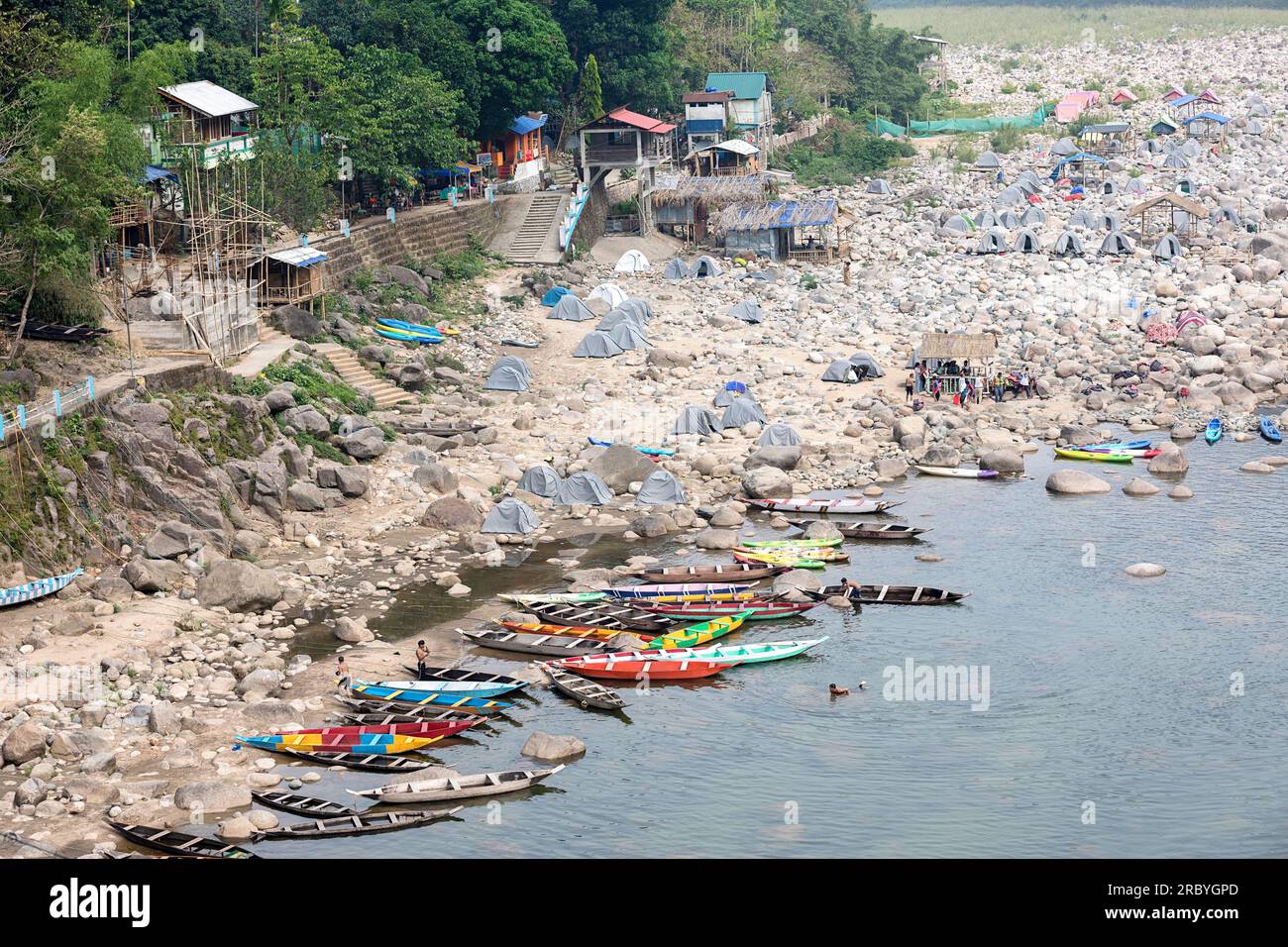 Traditional colourful wooden boats on dawki river parked on a river ...