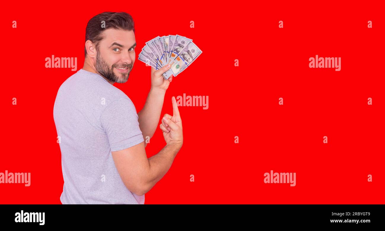 American man with money cash. Dollar banknotes. Portrait of man holding ...
