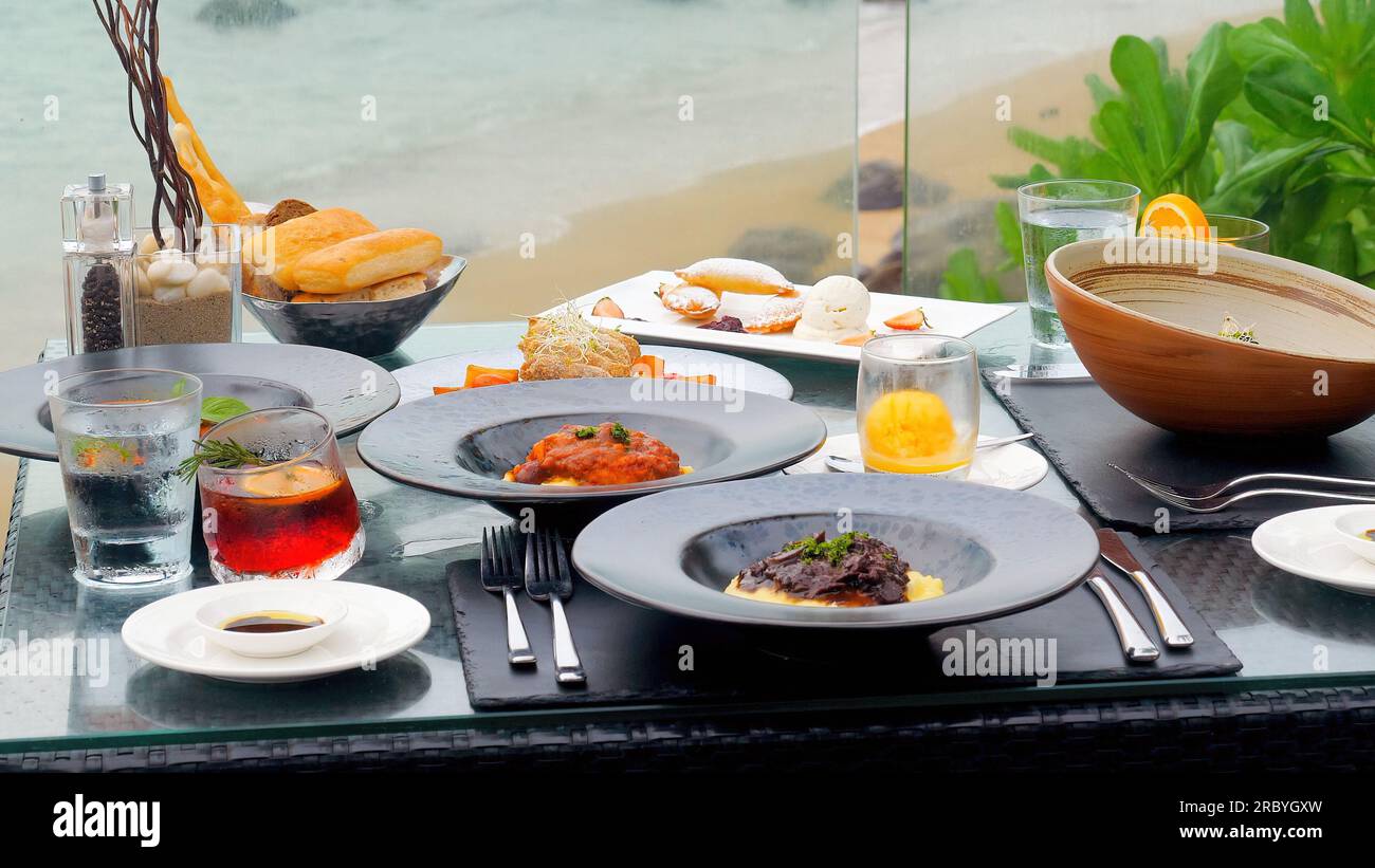 Romantic beachfront dinner for two at a luxury restaurant Stock Photo ...