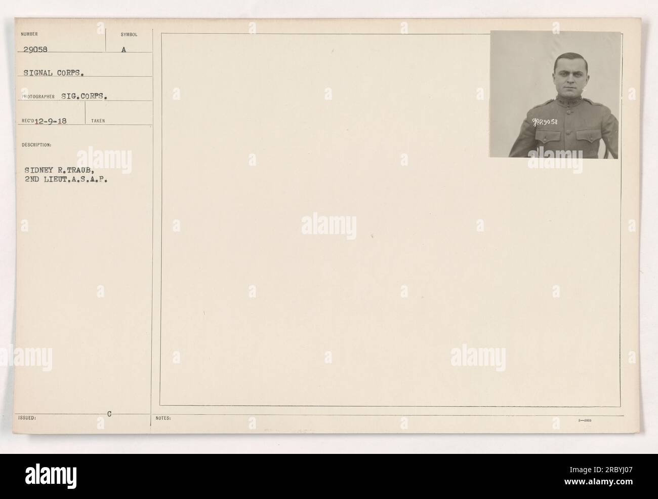 American soldiers in World War One are gathered around a wooden ...