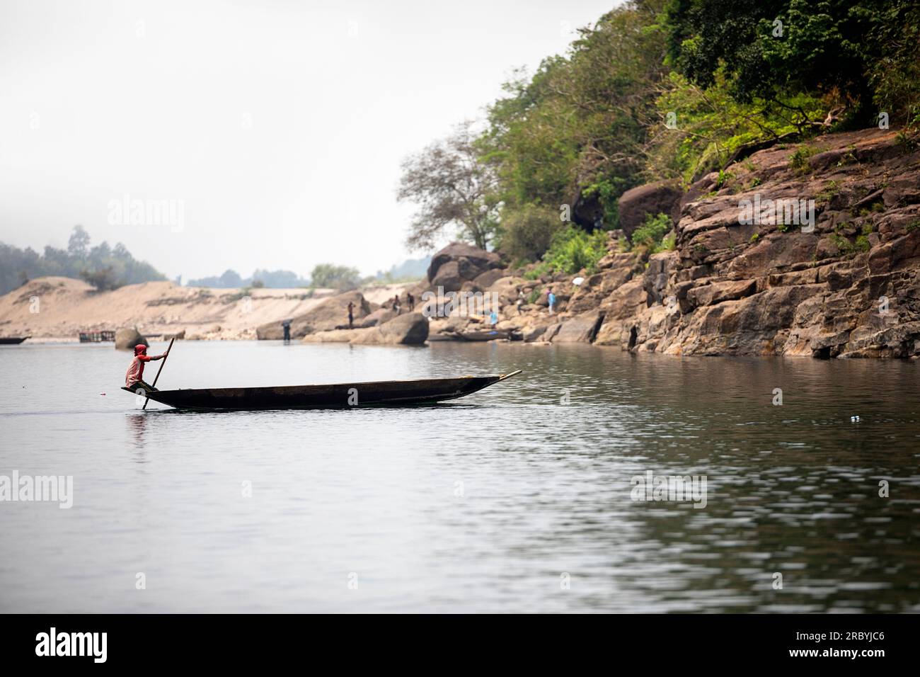 Man rowing in traditional wooden boat at Umtong river, Dawki, Meghala ...