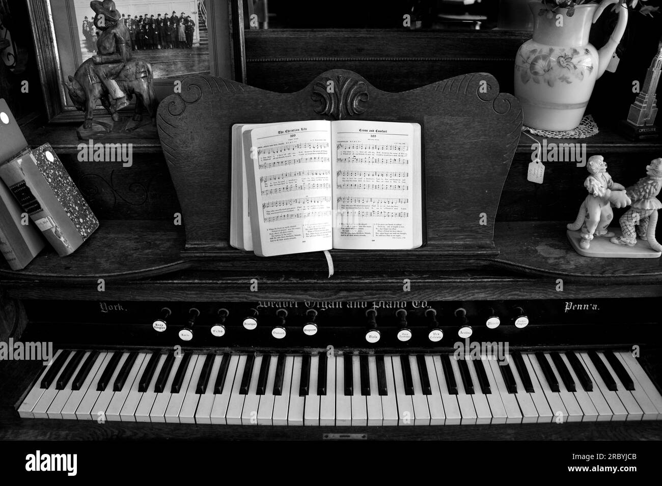 An antique parlor organ, or pump organ, for sale in an antique shop in ...