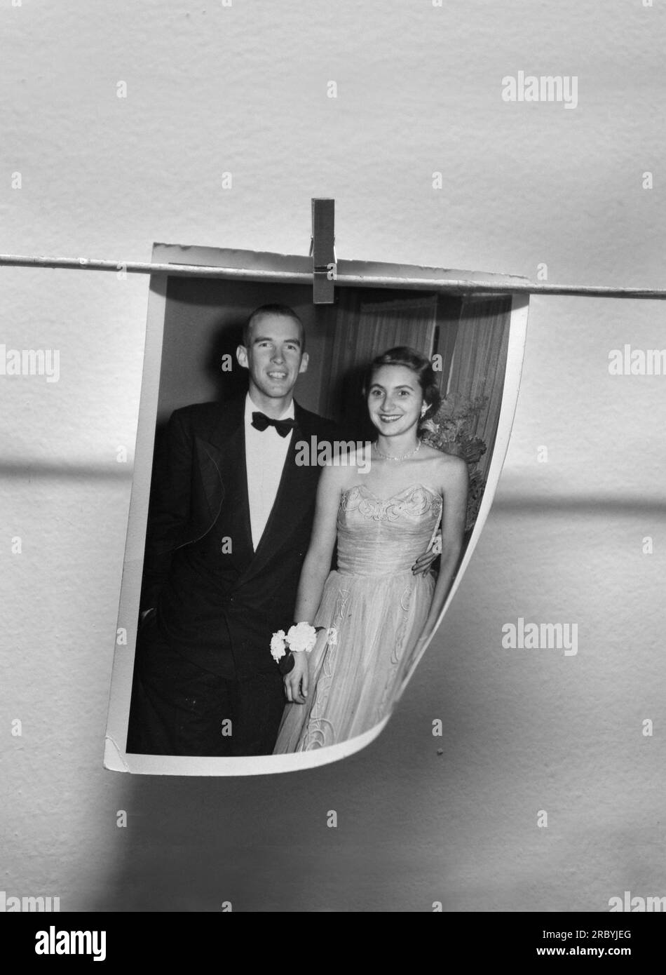 A 1950s prom portrait of a formally-dressed young American couple for ...