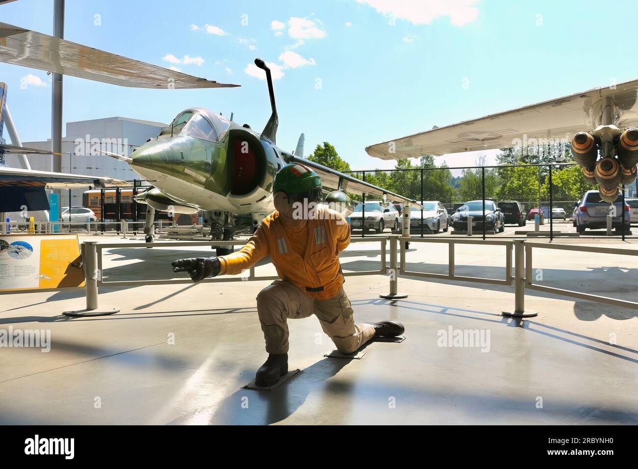McDonnell Douglas AV-8C Harrier VTOL fighter jet with a member of the ...