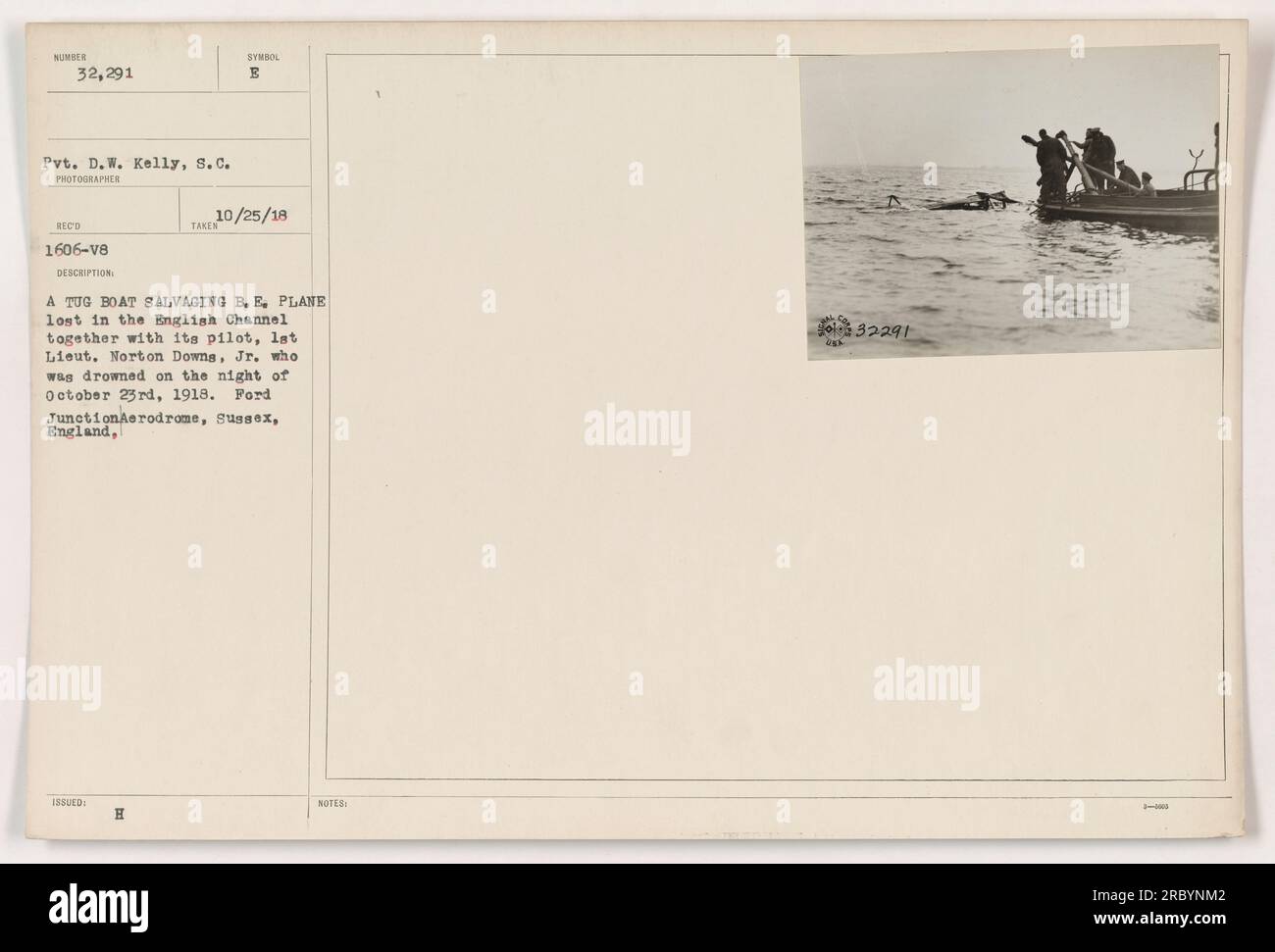 Private D. W. Kelly of the Signal Corps is pictured alongside a tugboat ...