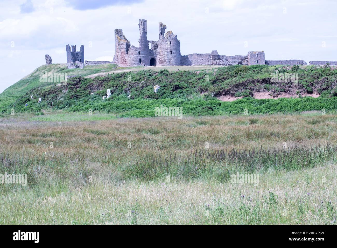 Dunstanburgh Castle, Northumberland is a 14th-century fortification on ...