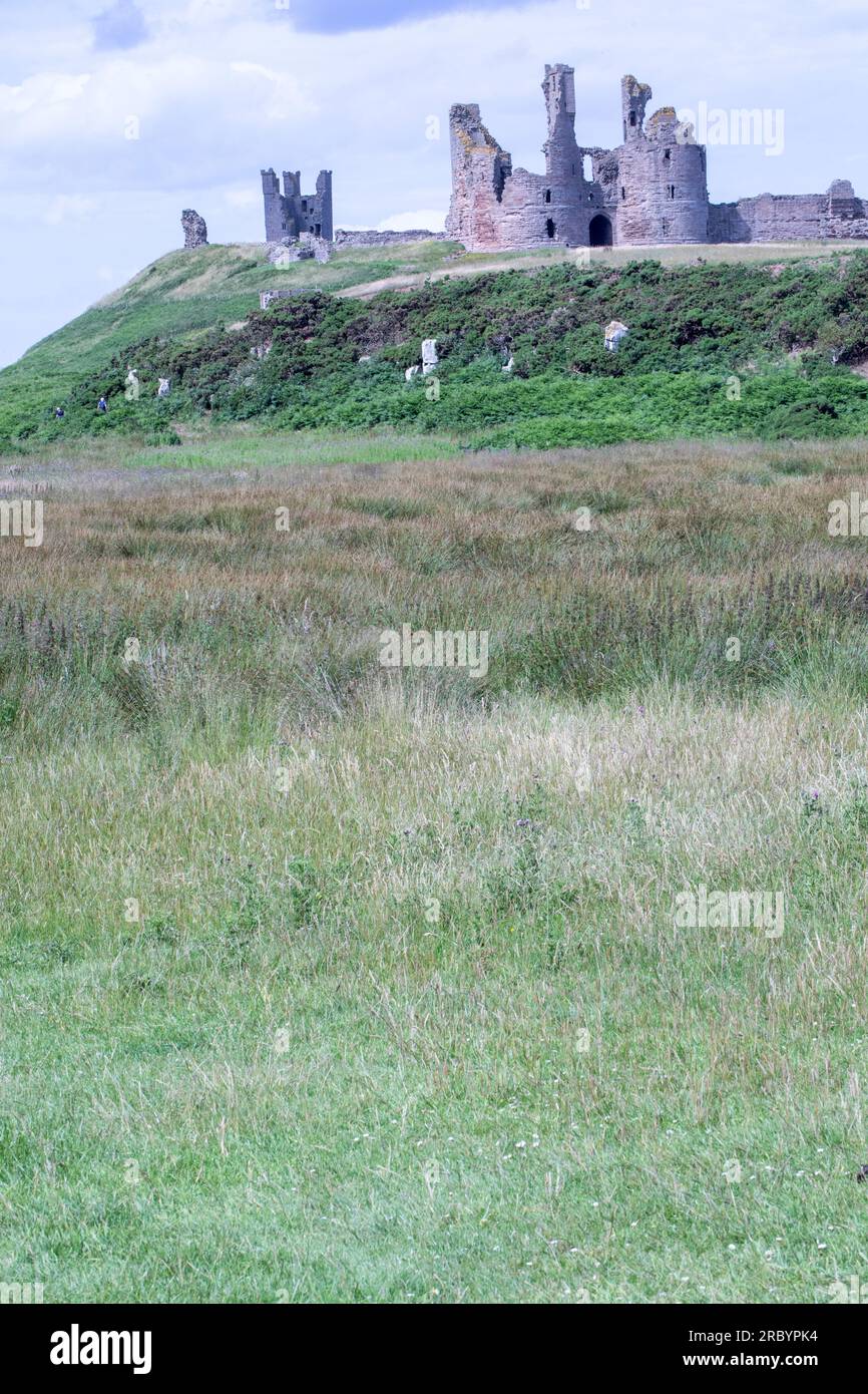 Dunstanburgh Castle, Northumberland is a 14th-century fortification on ...