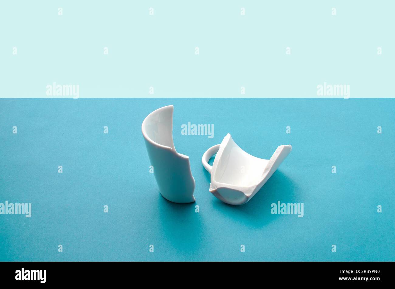 Cup broken in half, symbolizing the break and the end of something that ...