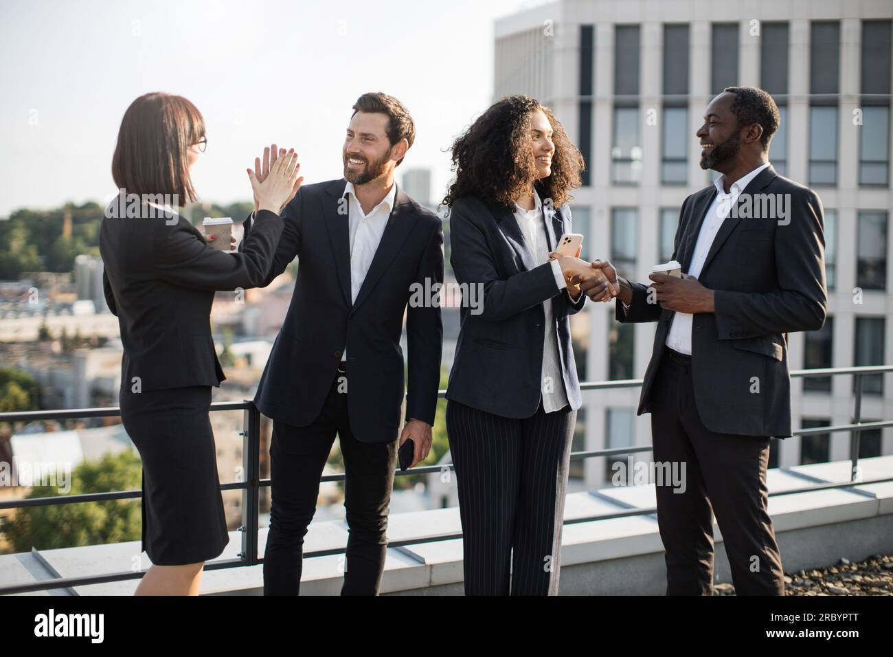 Team of foreign investors of different ethnicities shaking hands after ...