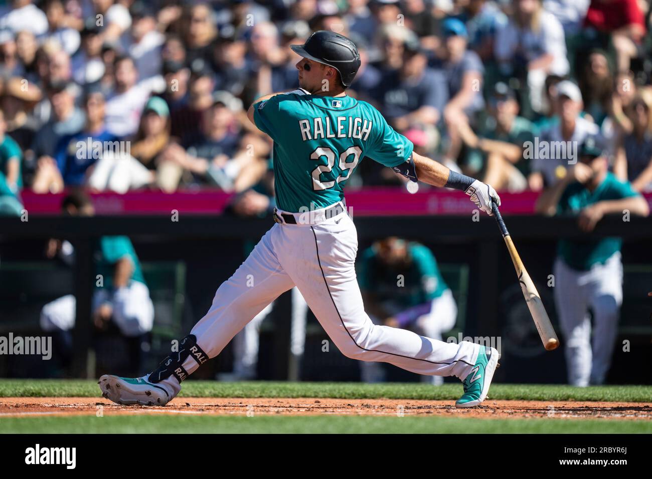 Seattle Mariners' Cal Raleigh takes a swing during an at-bat in a ...