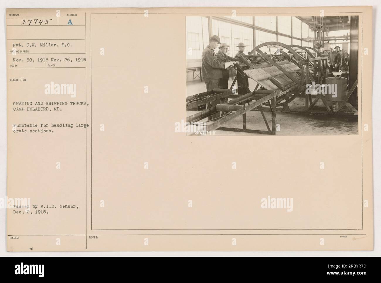Pvt. J.W. Miller from the Signal Corps is seen crating and shipping ...