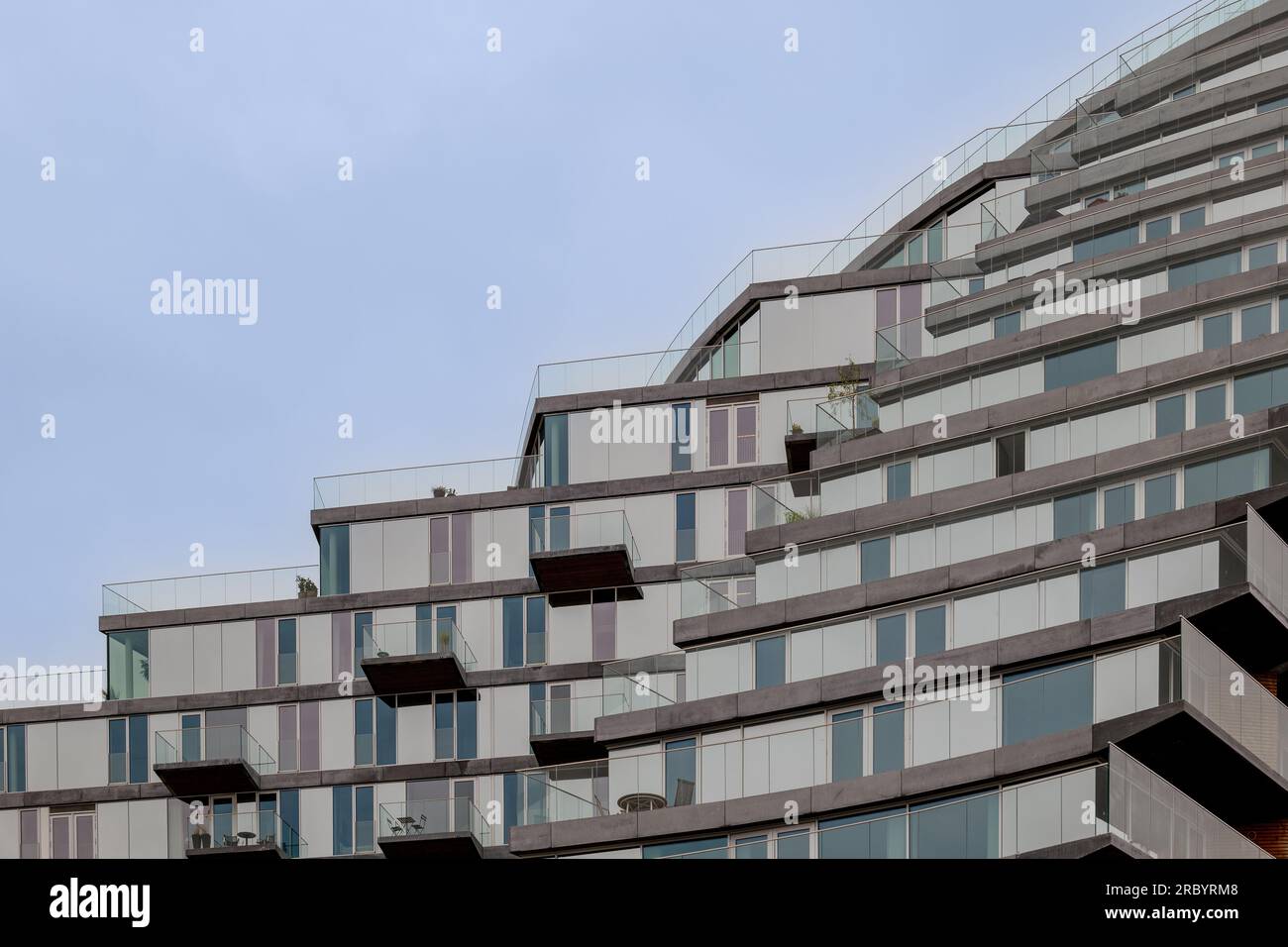 Low angel perspective view of minimal modern skyscraper with horizontal ...