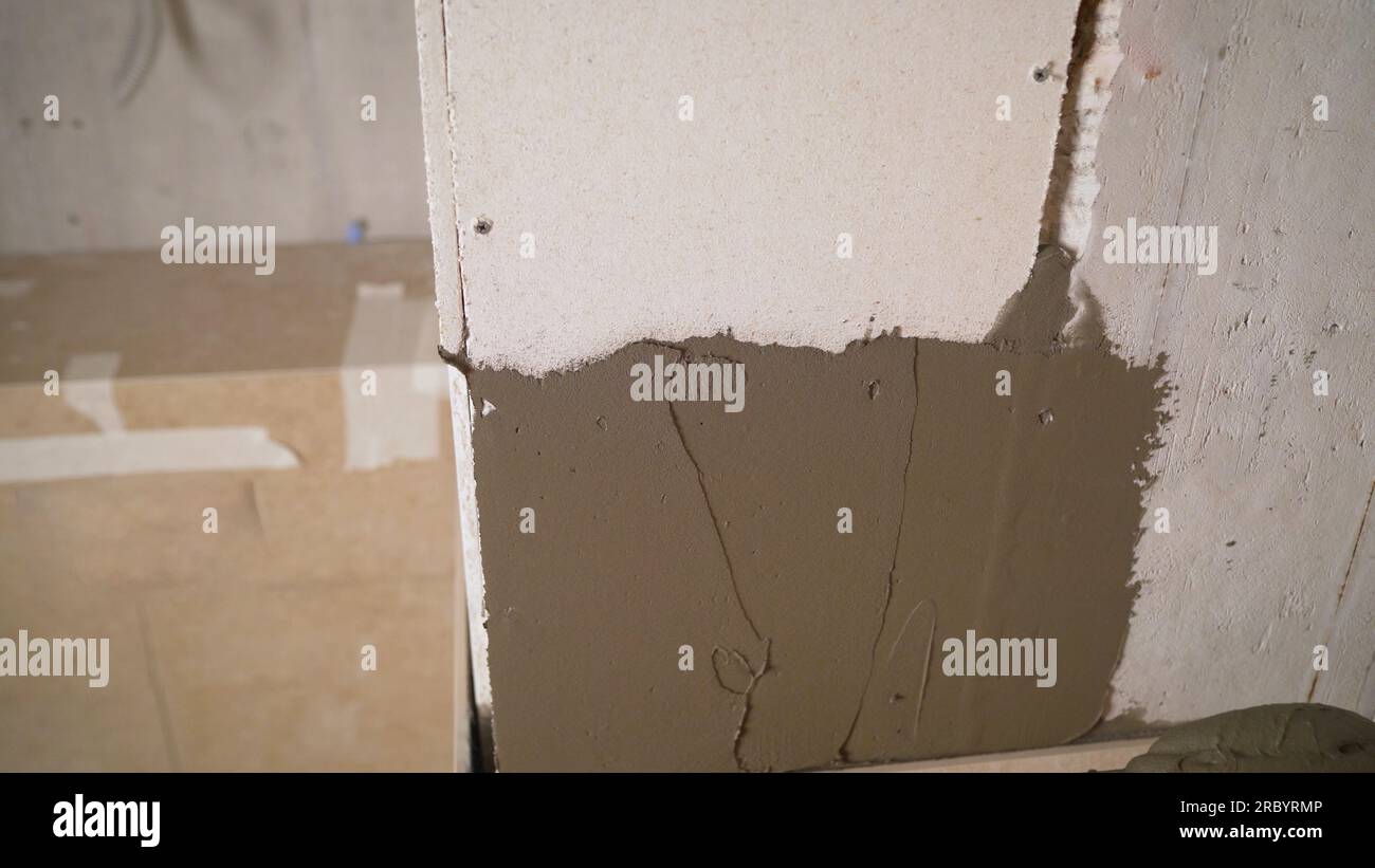 Close-up of cement adhesive on the wall to stick ceramic tiles in the ...