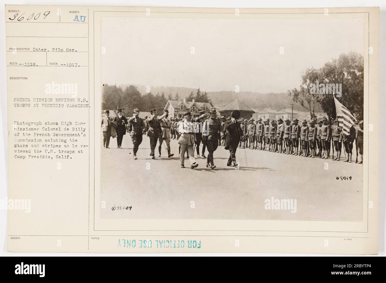 French Commissioner Colonel de Billy salutes the American flag while ...
