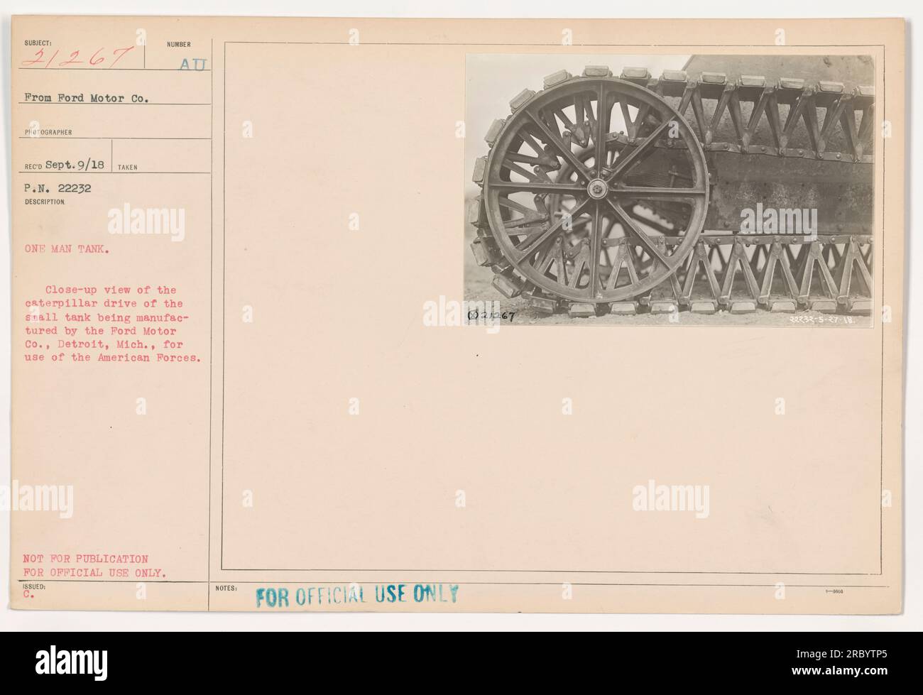 Close-up view of the caterpillar drive mechanism of a small tank being ...