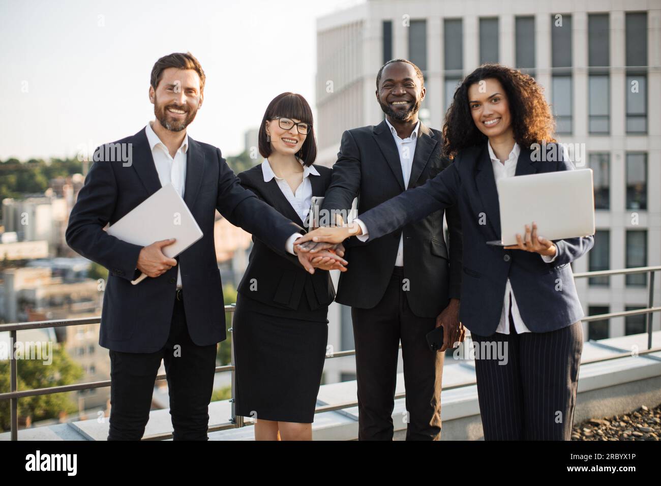 Portrait of cheerful business partners of different nationalities ...