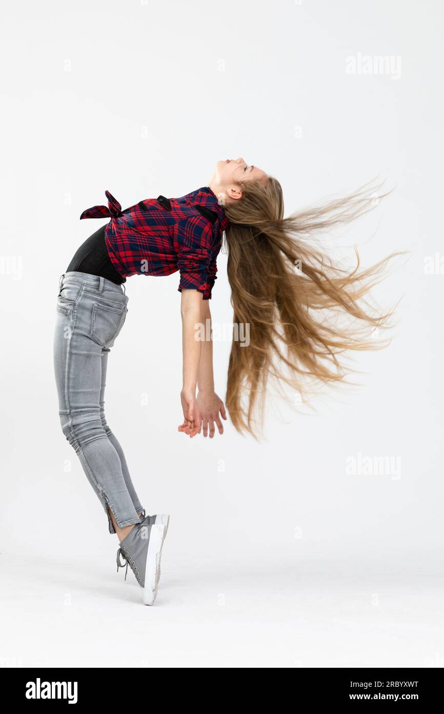 Young girl throws back her long hair in the air Stock Photo - Alamy