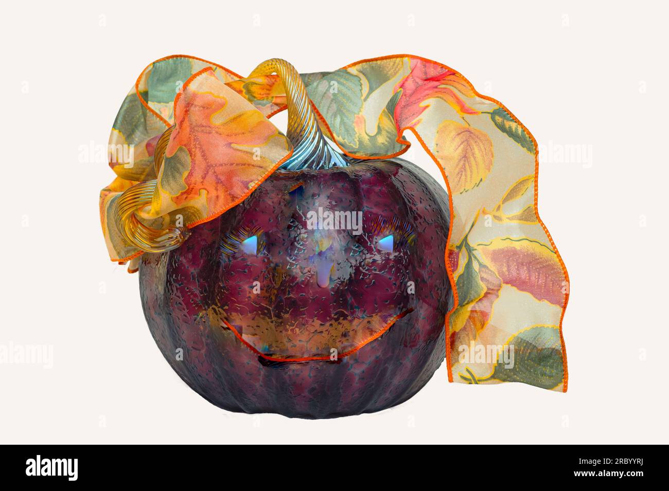 Blown glass pumpkin with colorful fall ribbon on top of head has a ...