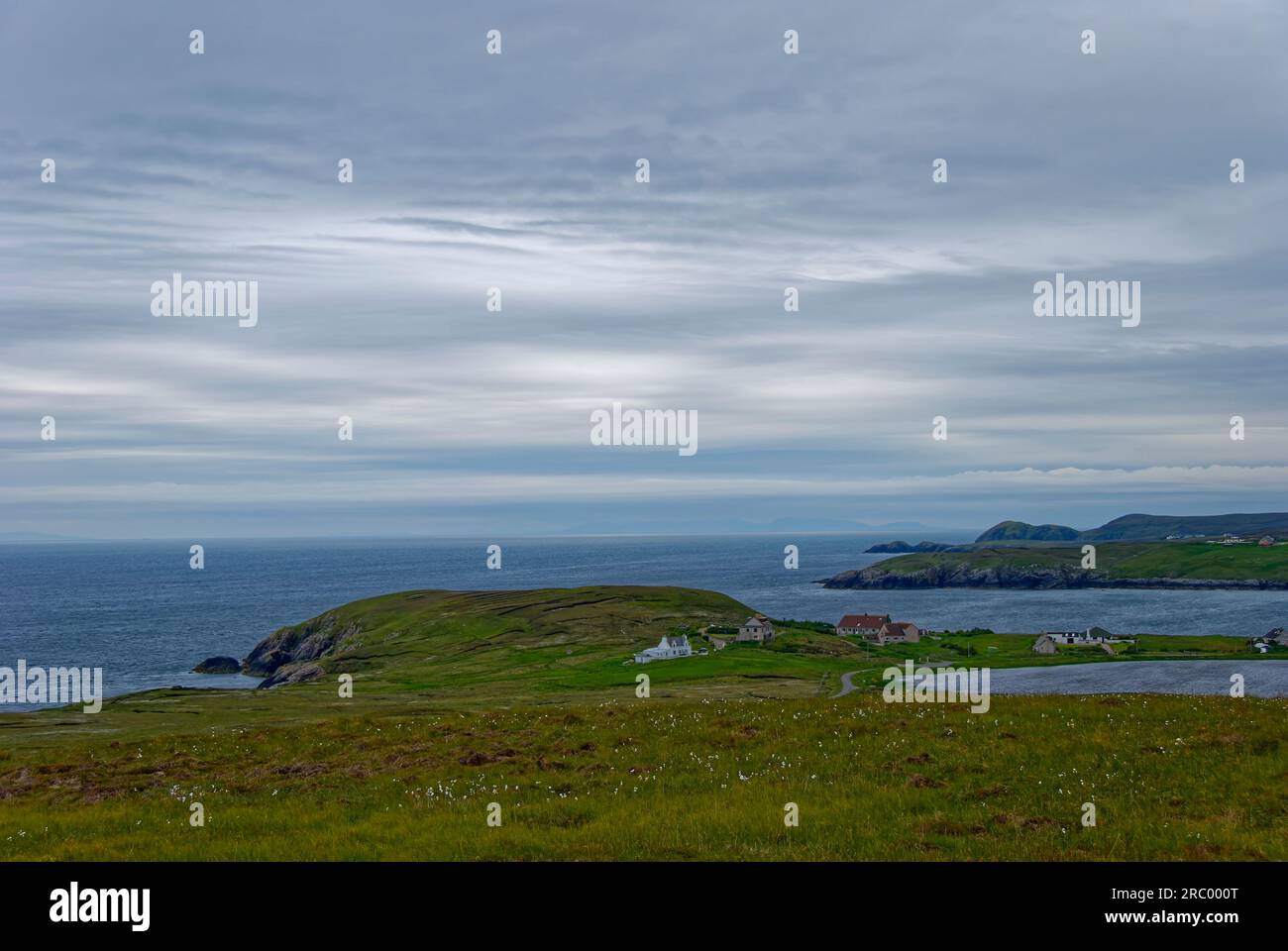 Grey clouds over the Eye Peninsula at Tiumpan Head with the small ...
