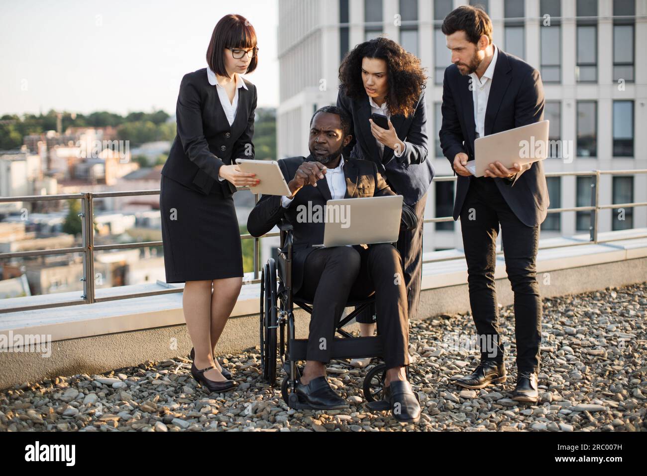 Multiracial businessman using multiple digital hi-res stock photography ...