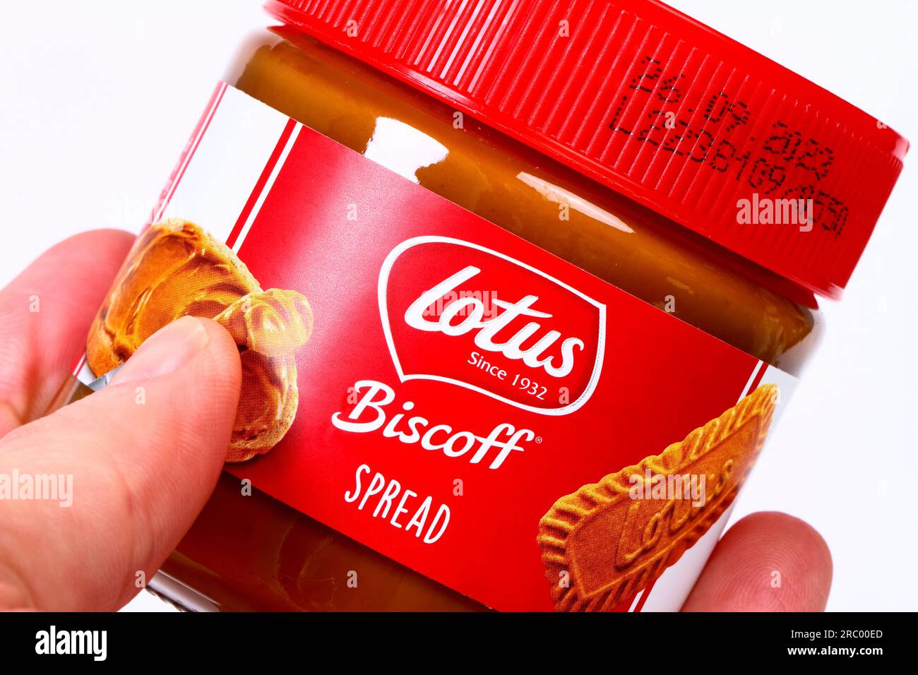 Man's hand holding a jar of Lotus Biscoff Spread Stock Photo - Alamy