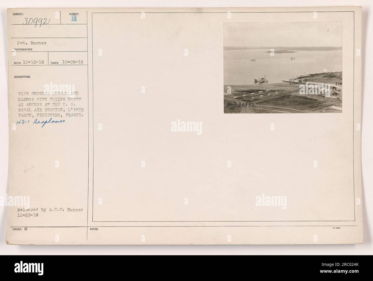 A photograph showing the view of an airway and harbor with flying boats ...