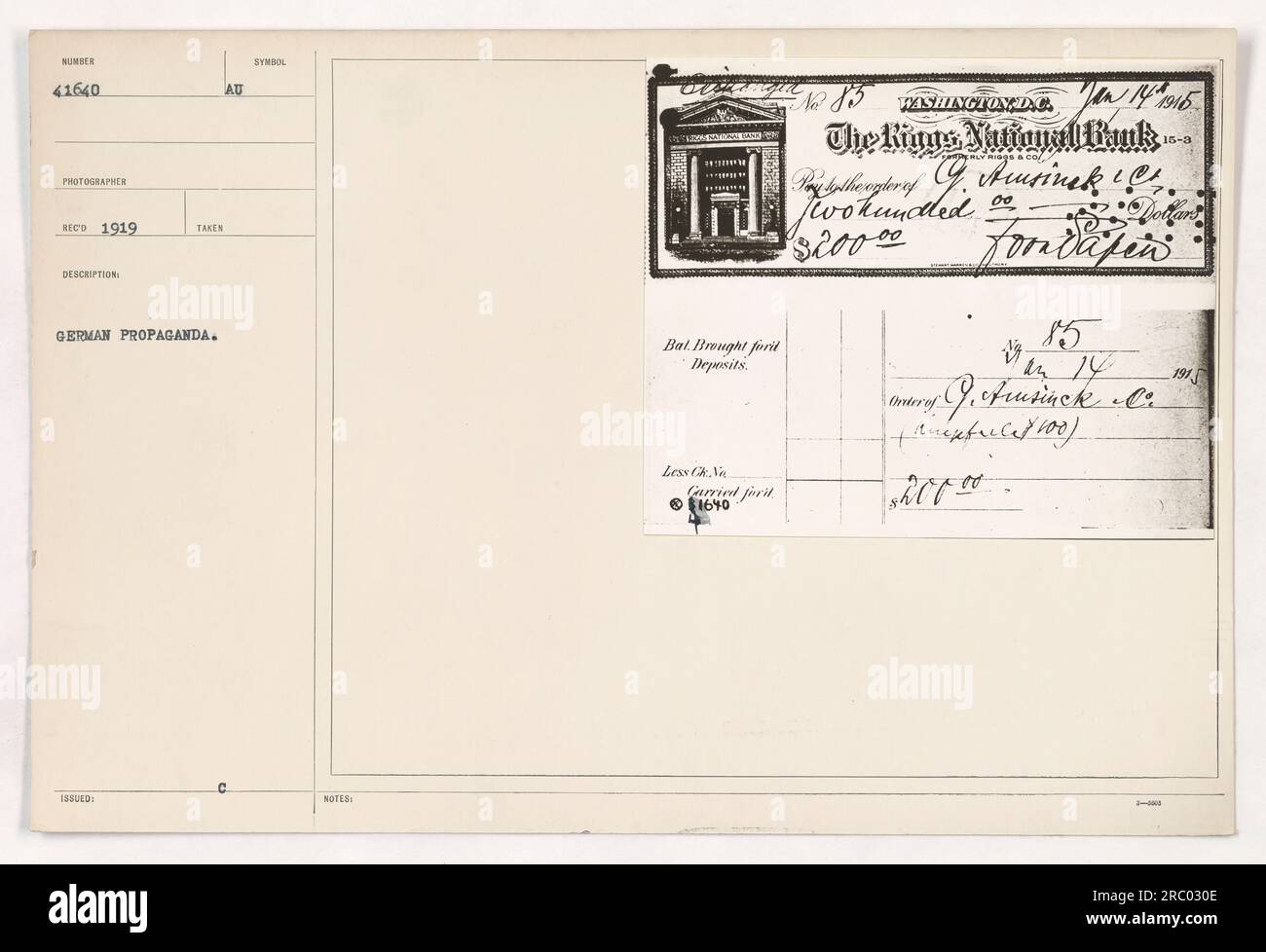 American soldiers examining a captured German propaganda poster during ...