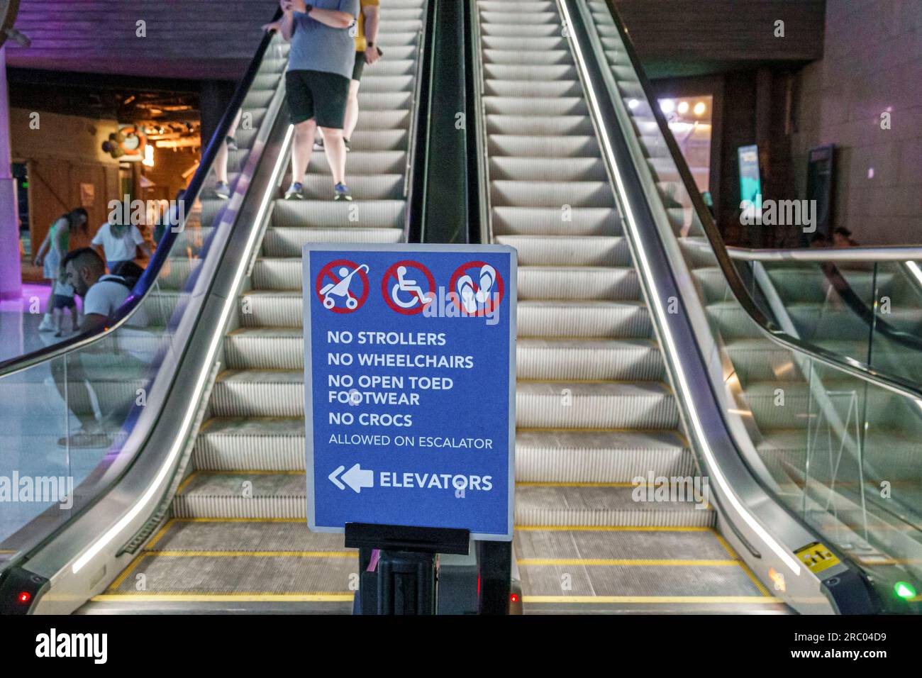 Atlanta Georgia,Georgia Aquarium,inside interior exhibits,escalator sign warning Stock Photo - Alamy