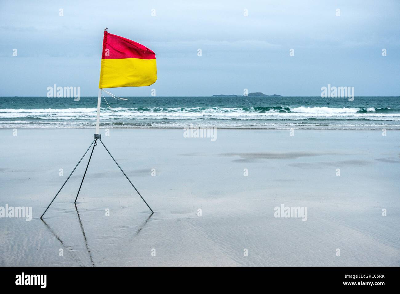 Lifeguard's flag on beach at Whitesands Bay in Pembrokeshire, Wales ...