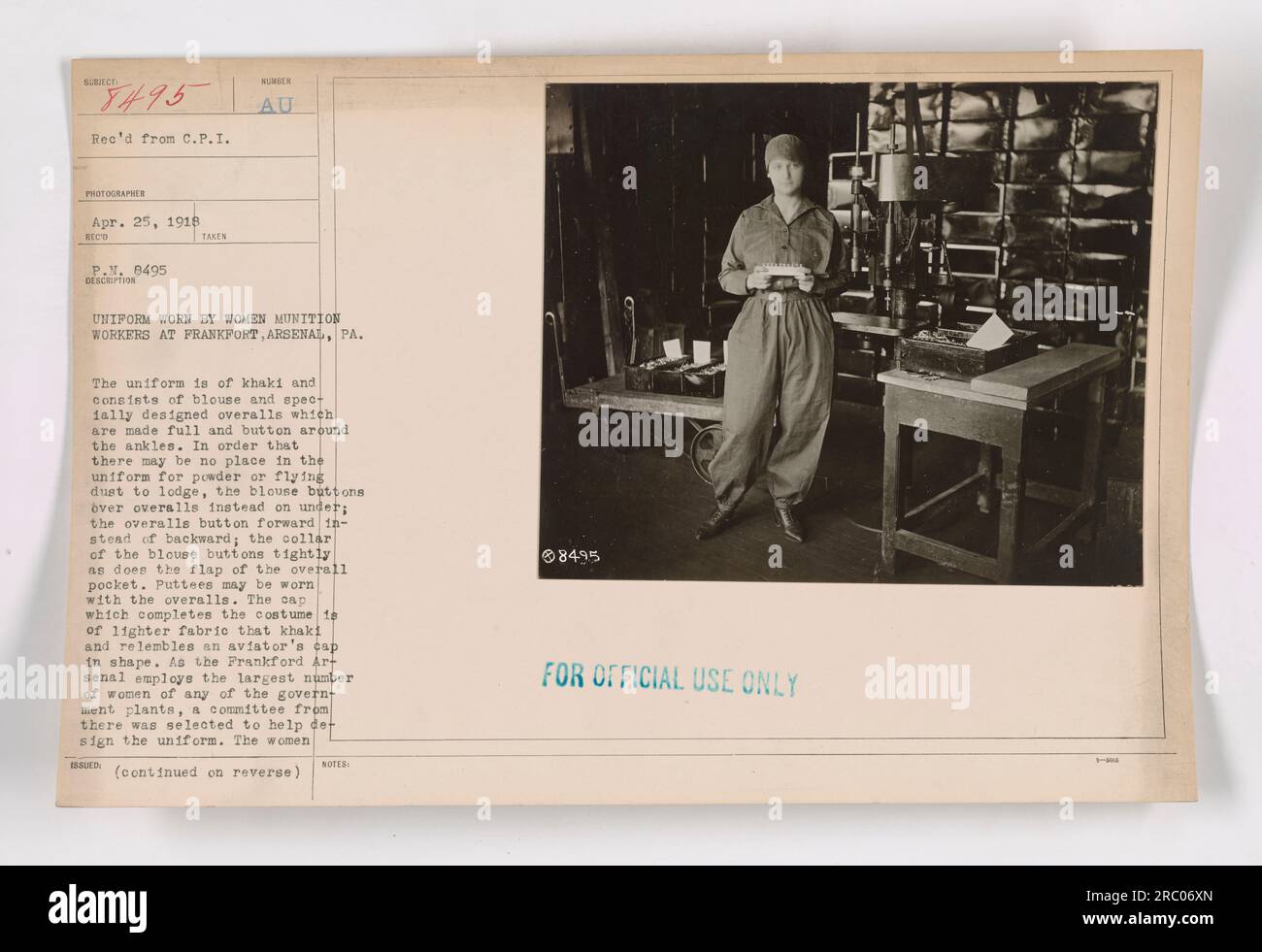 "Women munition workers wearing khaki uniforms consisting of blouses ...